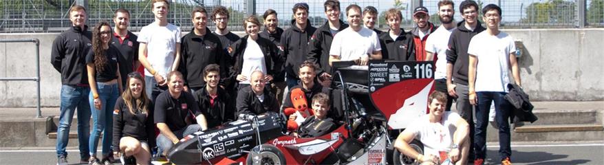 Cardiff University team with single seat racing car